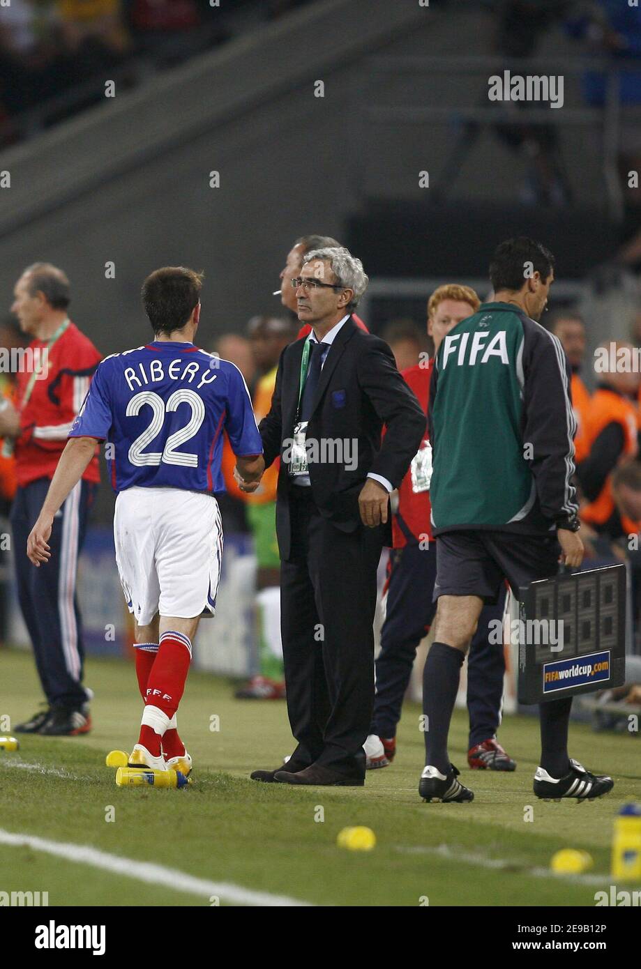 France's Franck Ribery shakes hand with coach Raymond Domenech during ...