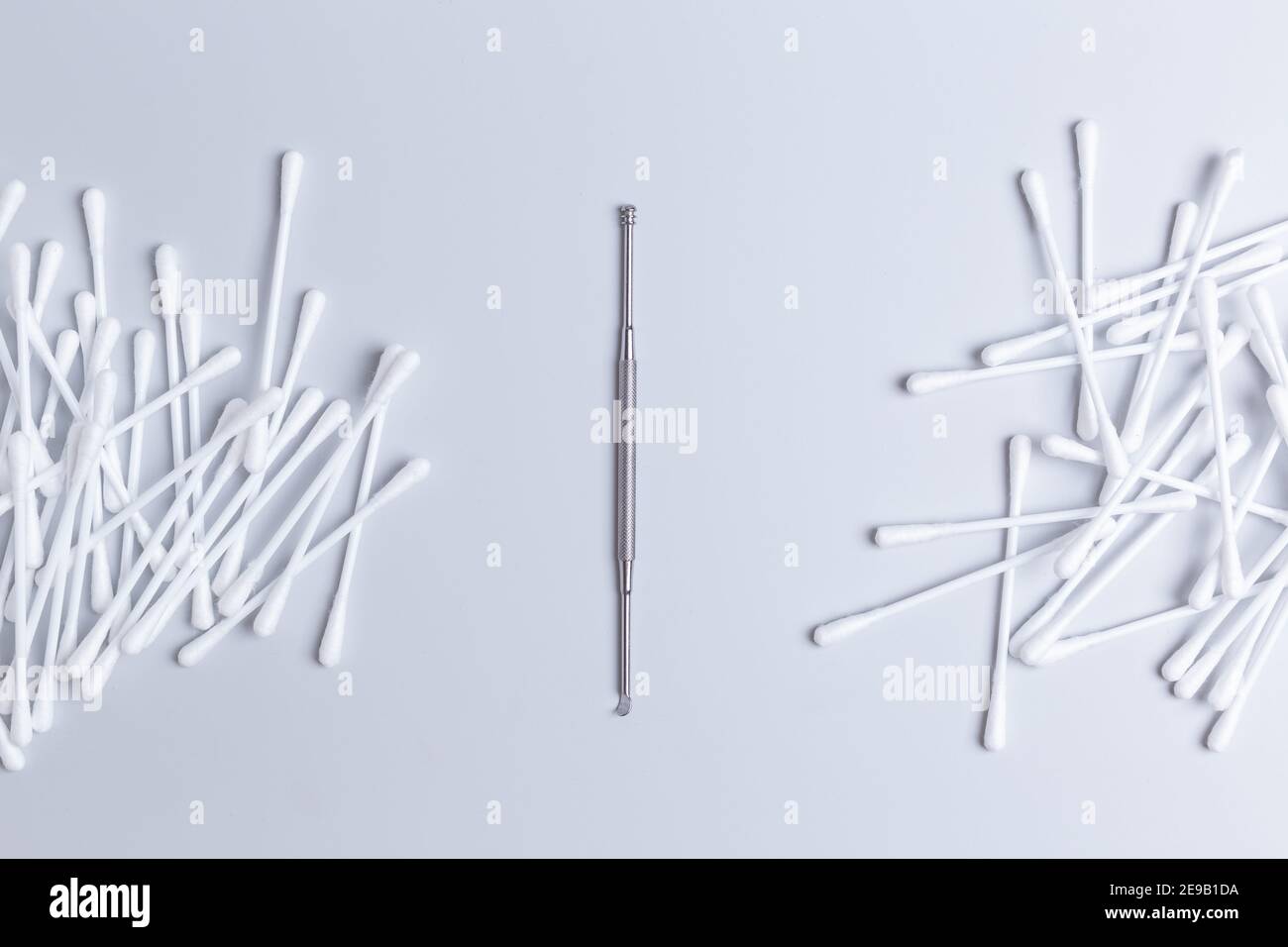 reusable metal ear stick vs a lot of plastic sticks white and black ...