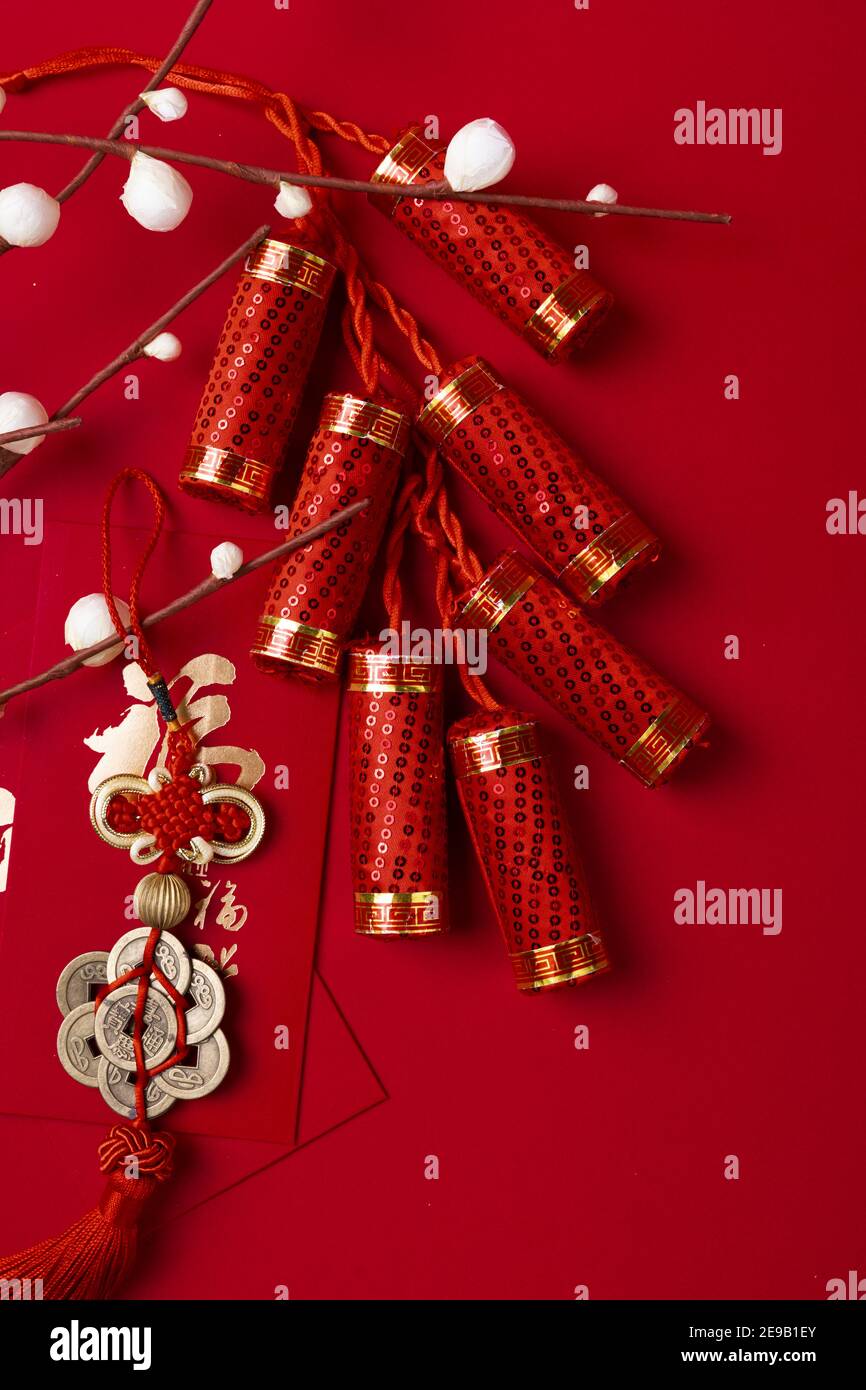 Chinese new year firecracker and envelope on a red background Stock ...