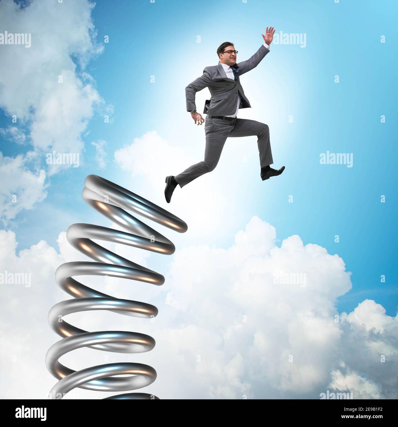 The businessman jumping from spring in promotion concept Stock Photo ...