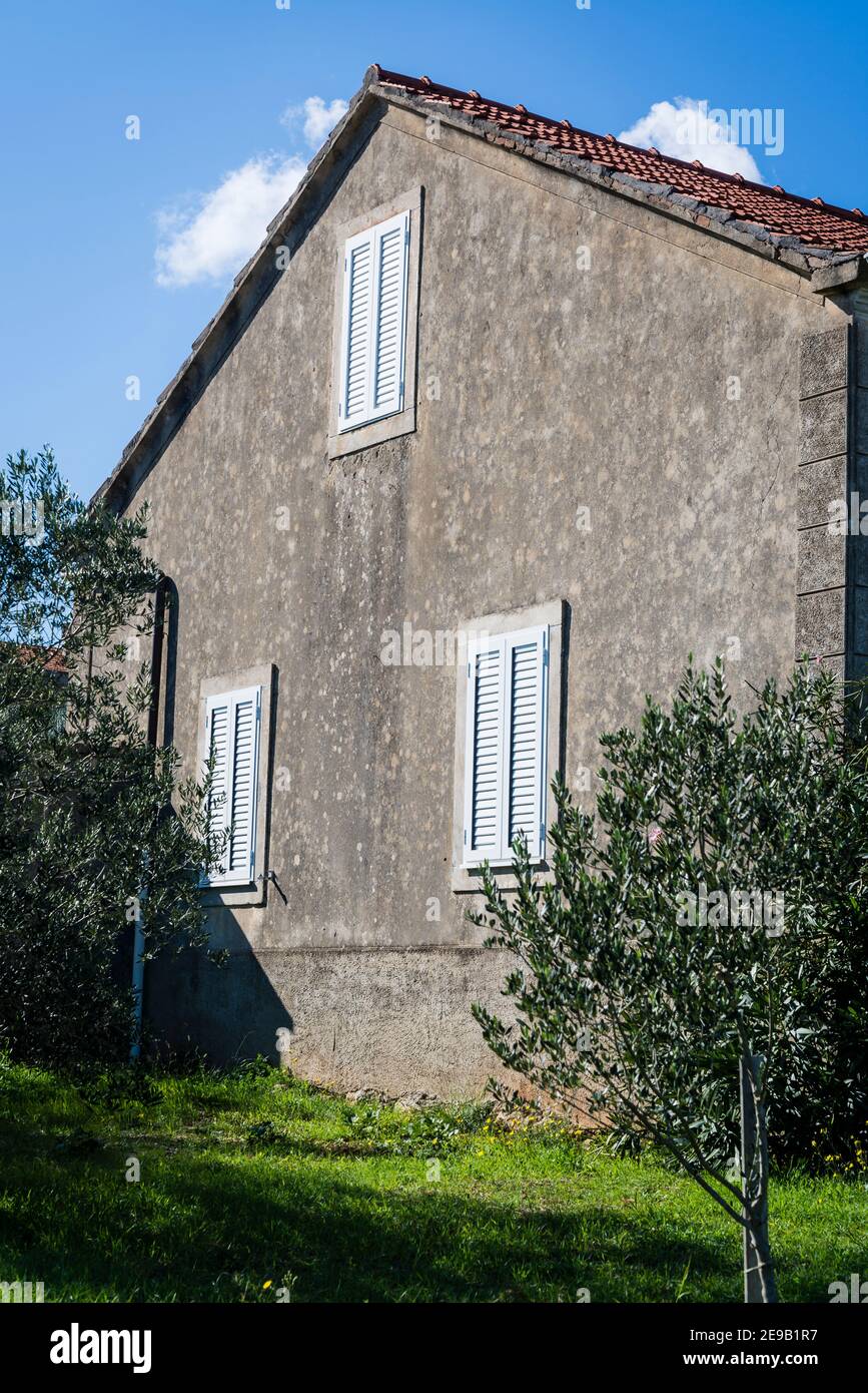 House with white window shutters, Veli Iz, Island of Iz, Zadar ...