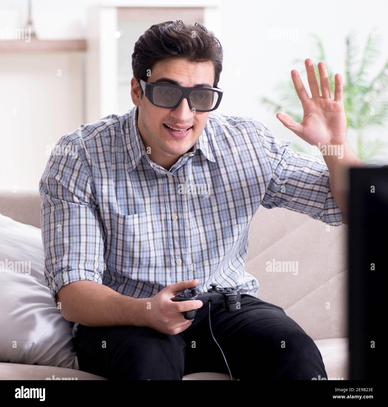 The man playing 3d games at home Stock Photo - Alamy