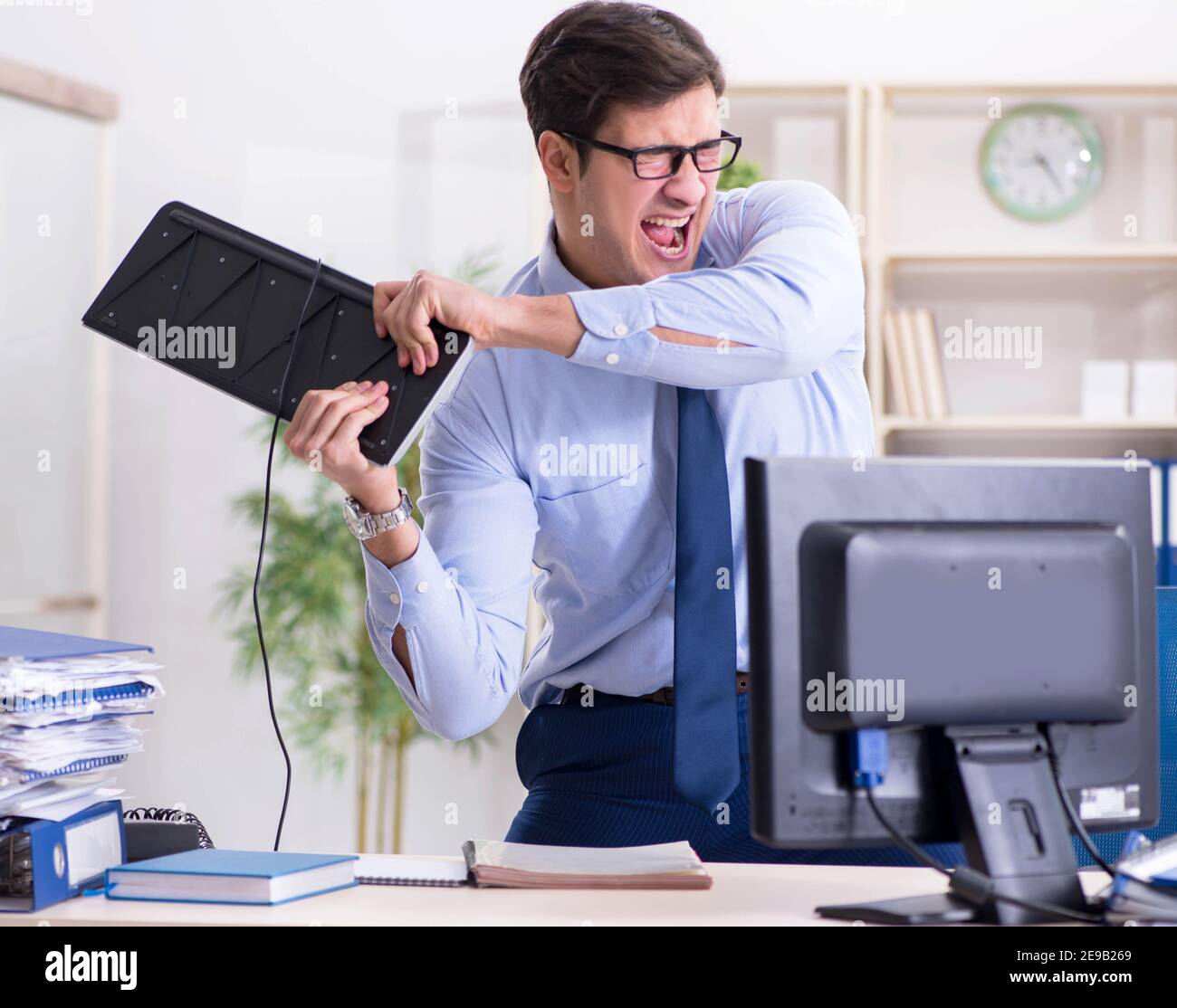 The angry businessman frustrated with too much work Stock Photo - Alamy