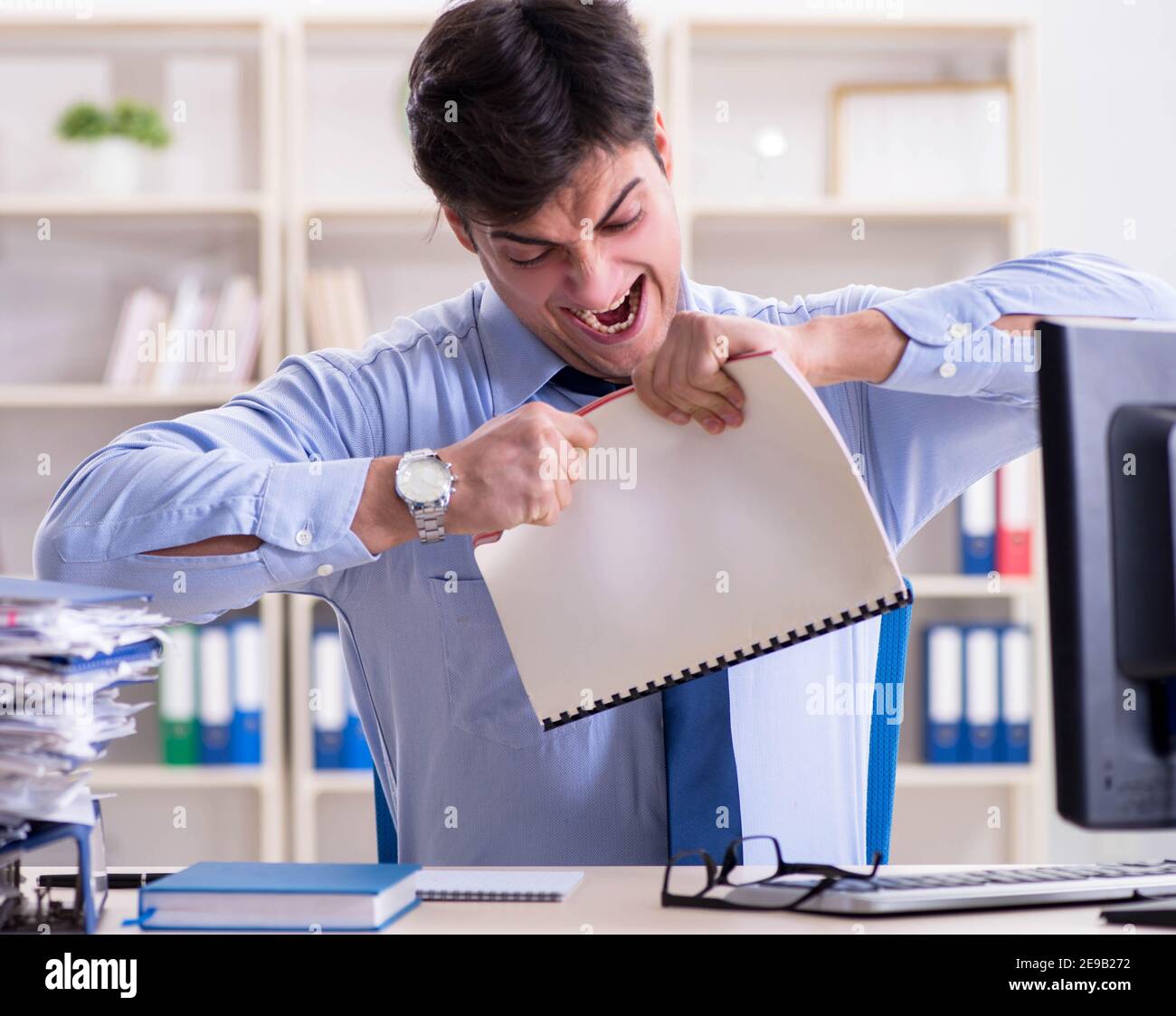 The tired businessman with too much paperwork Stock Photo - Alamy