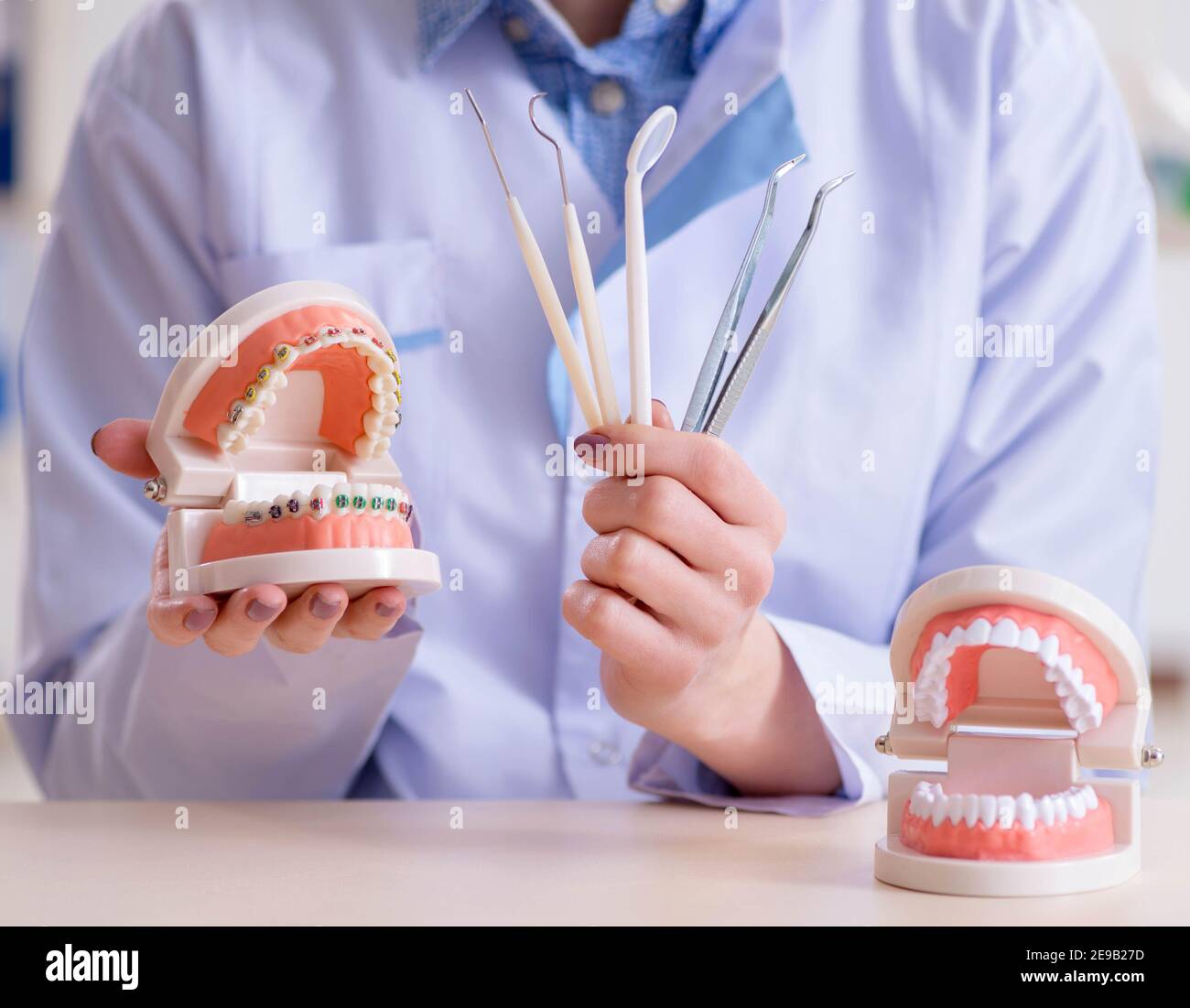 The dentist practicing work on tooth model Stock Photo - Alamy