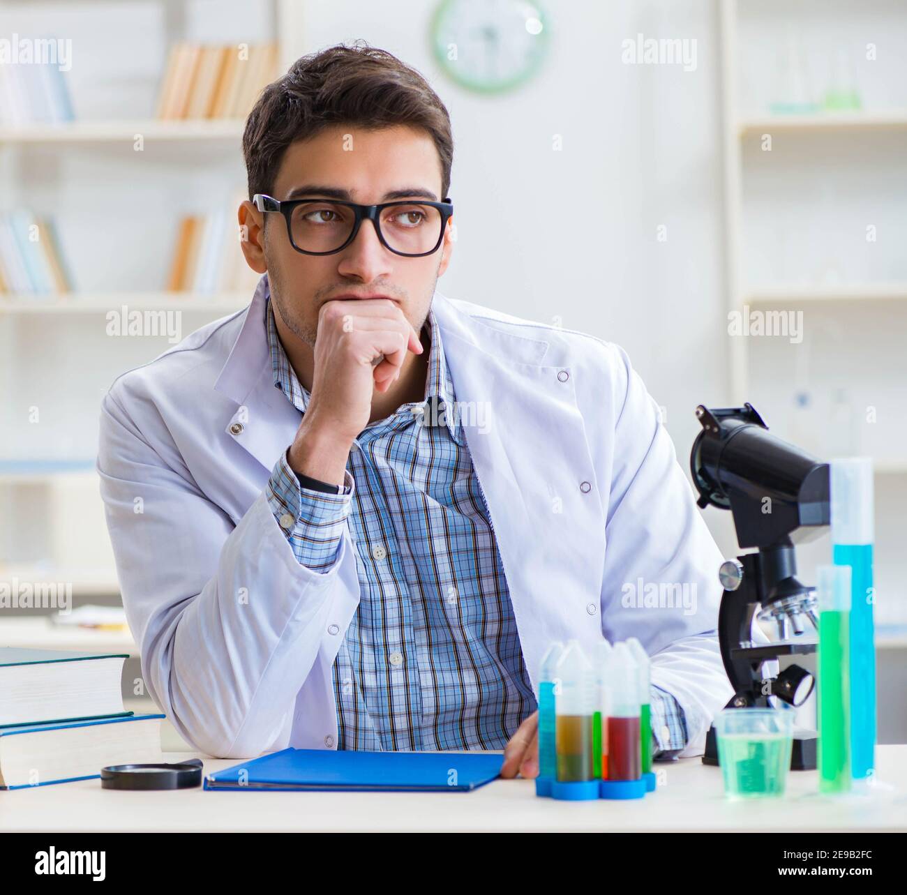 The young chemist student working in lab on chemicals Stock Photo - Alamy