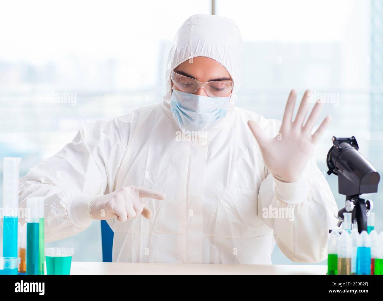 The young chemist pressing virtual buttons in lab Stock Photo - Alamy