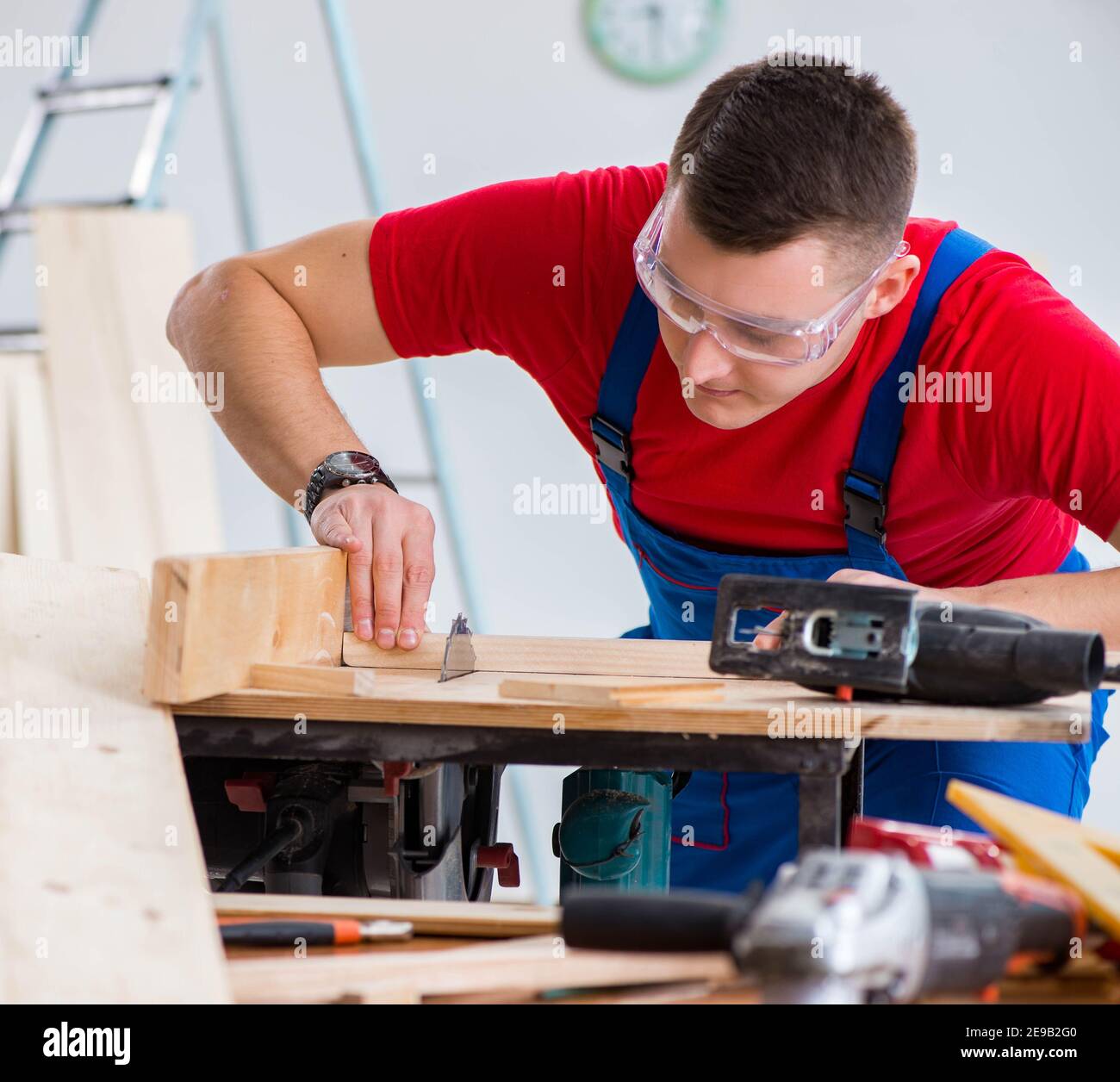 The contractor working in the workshop Stock Photo - Alamy