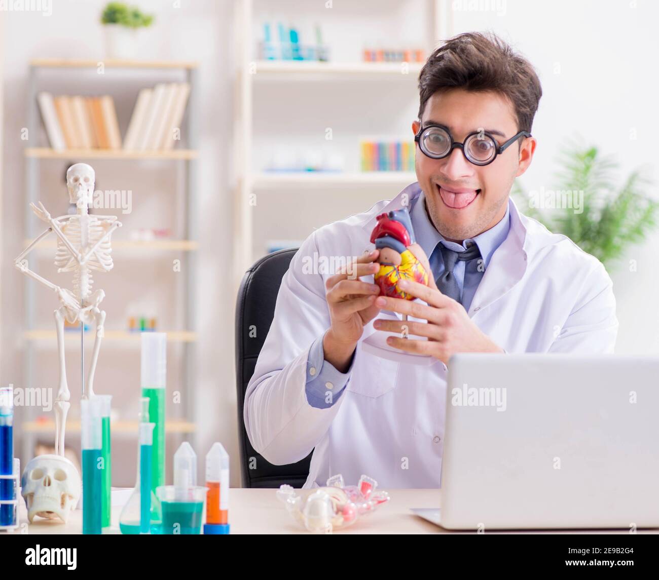 The funny doctor having fun in hospital lab Stock Photo - Alamy