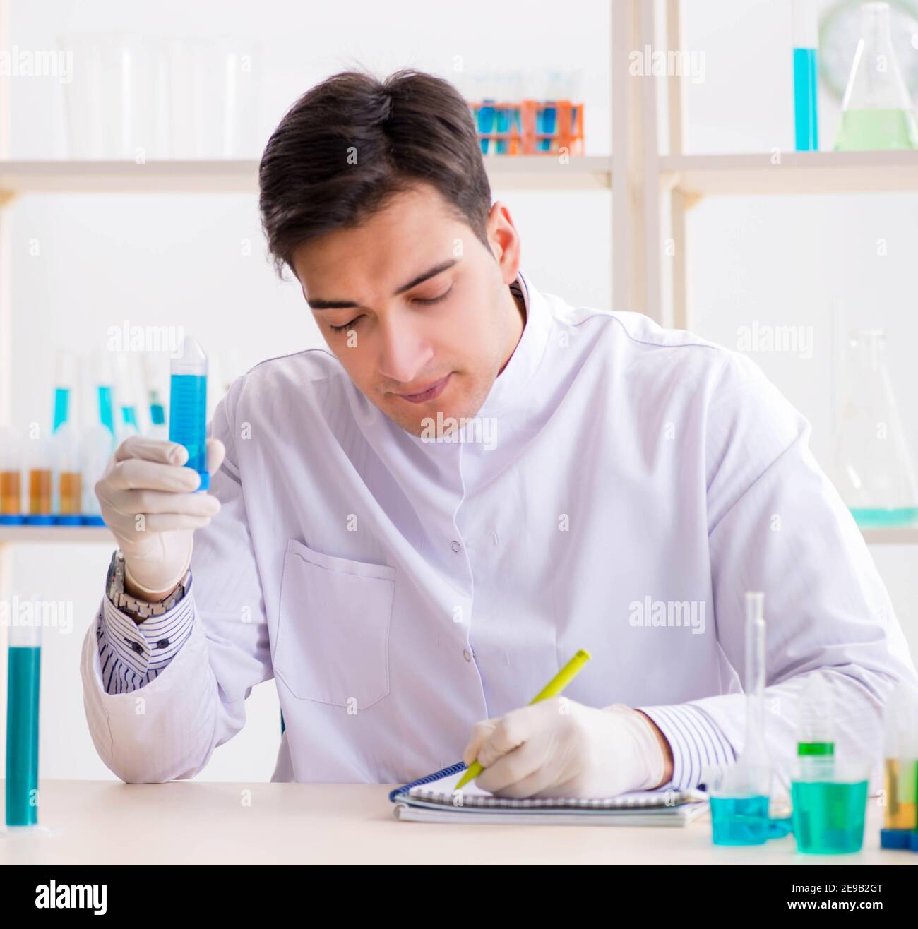 The young chemist student working in lab on chemicals Stock Photo - Alamy