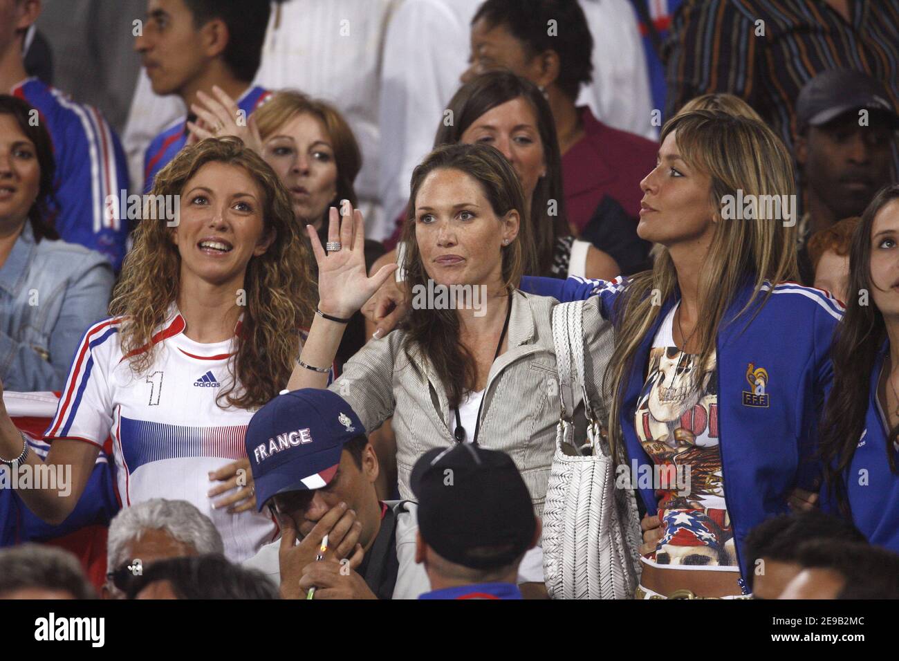 Thierry Henry's wife English model Nicole Merry (R) and David Trezeguet ...