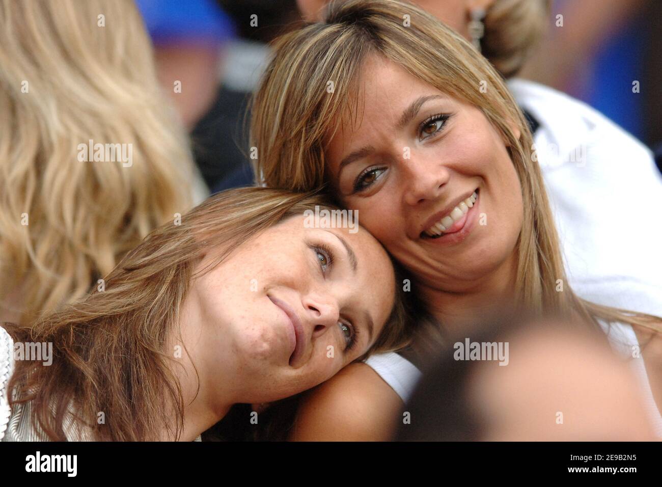 Thierry Henry's wife English model Nicole Merry (R) and David Trezeguet ...