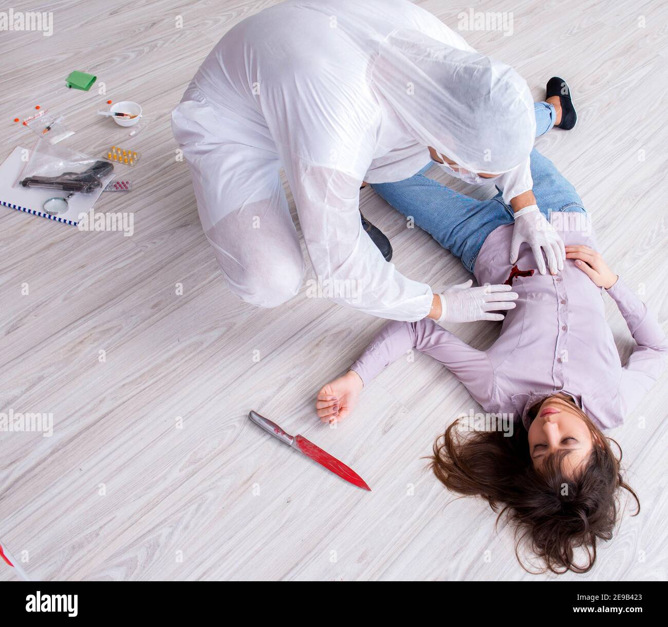 Forensic investigator at the crime scene investigating woman murder ...