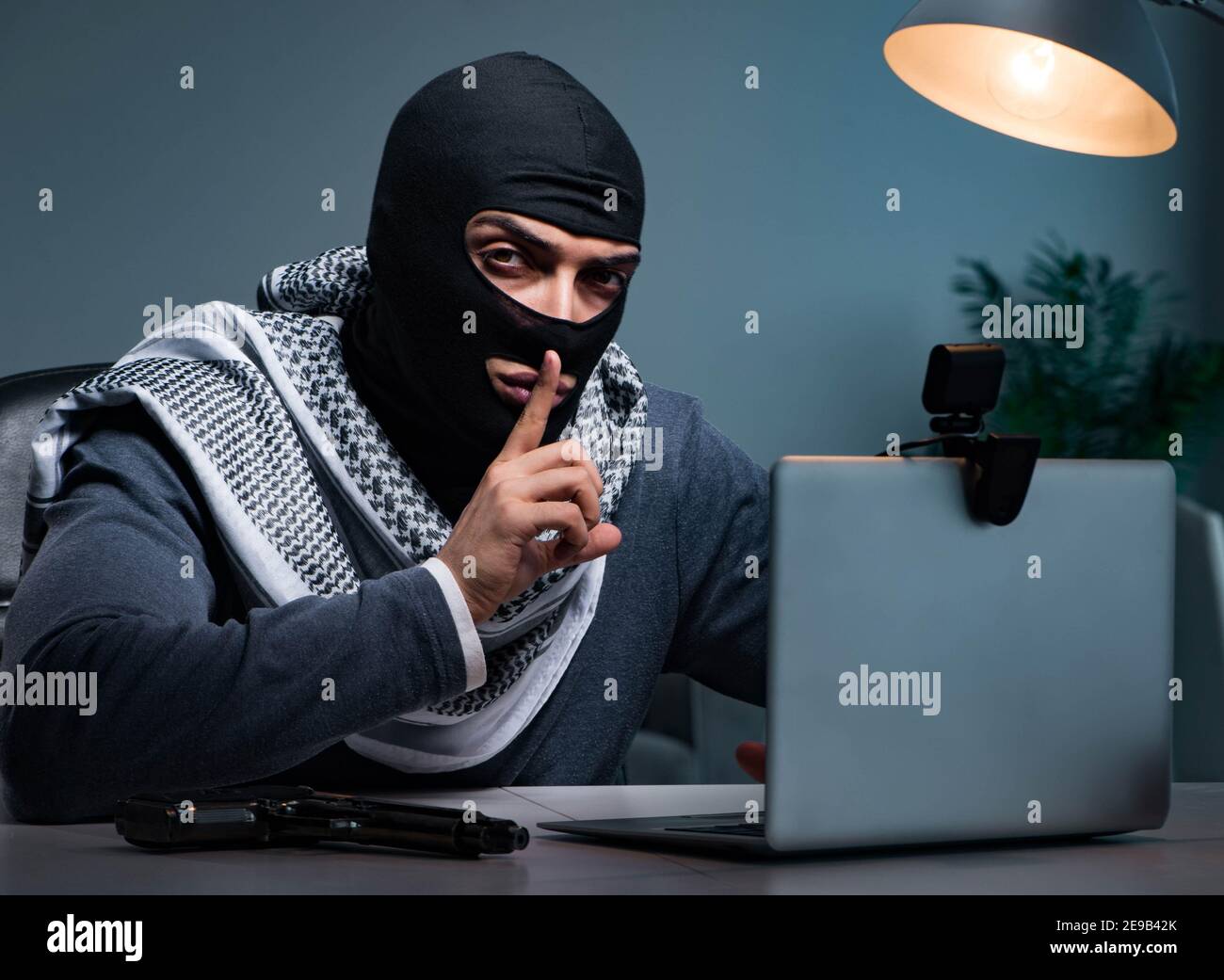 The hacker wearing balaclava mask hacking computer Stock Photo - Alamy