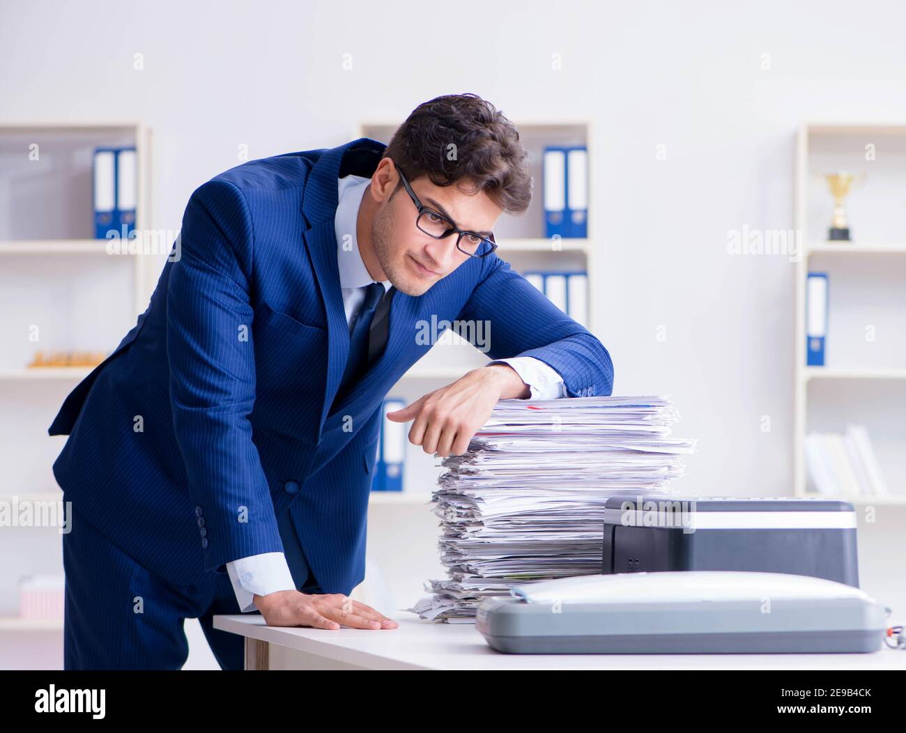 The businessman making copies in copying machine Stock Photo - Alamy