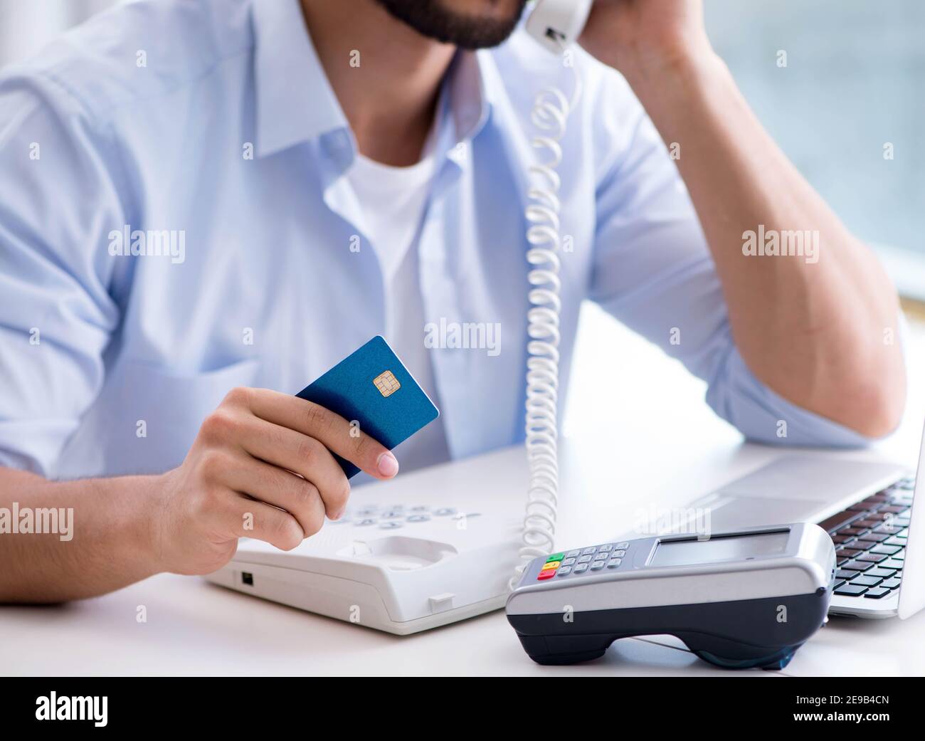 The man processing credit card transaction with pos terminal Stock ...