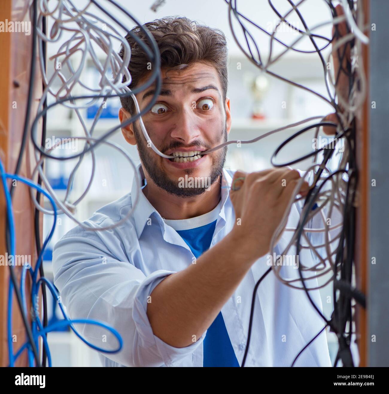 Electrician trying untangle wires hi-res stock photography and images ...