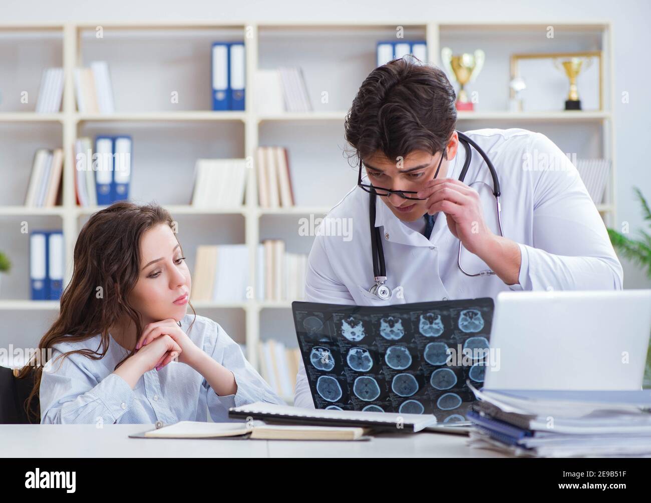 The doctor explaining to patient results of x-ray imaging Stock Photo ...