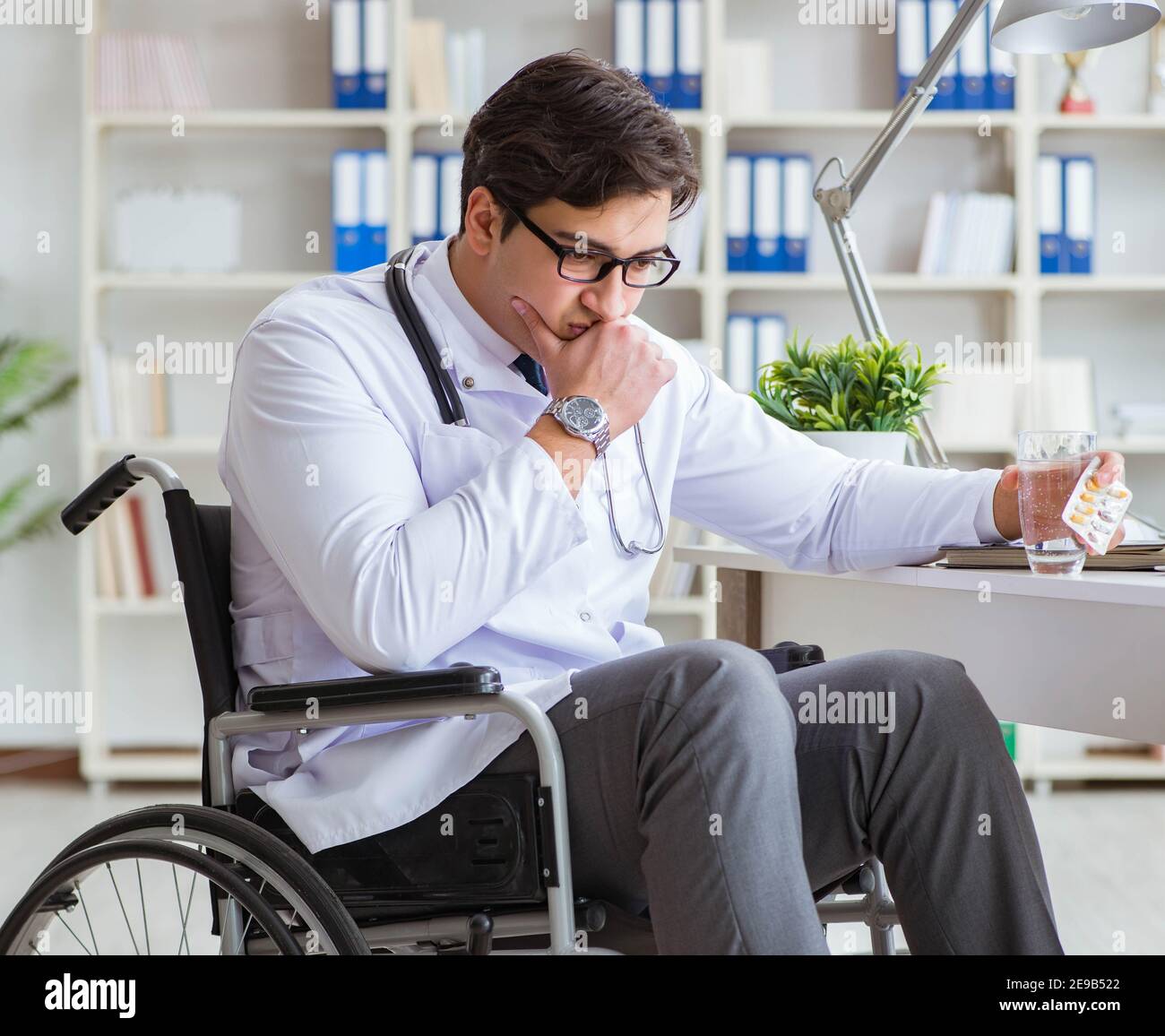The disabled doctor on wheelchair working in hospital Stock Photo - Alamy