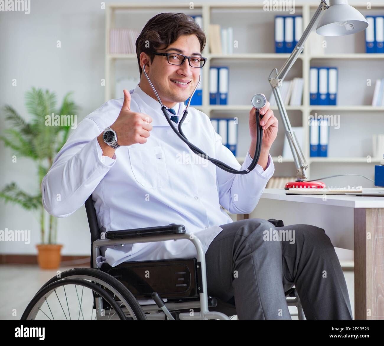 The disabled doctor on wheelchair working in hospital Stock Photo - Alamy