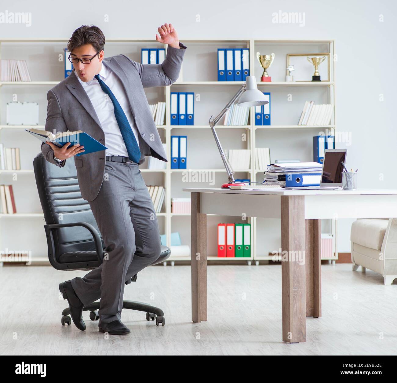 The businessman having fun taking a break in the office at work Stock ...