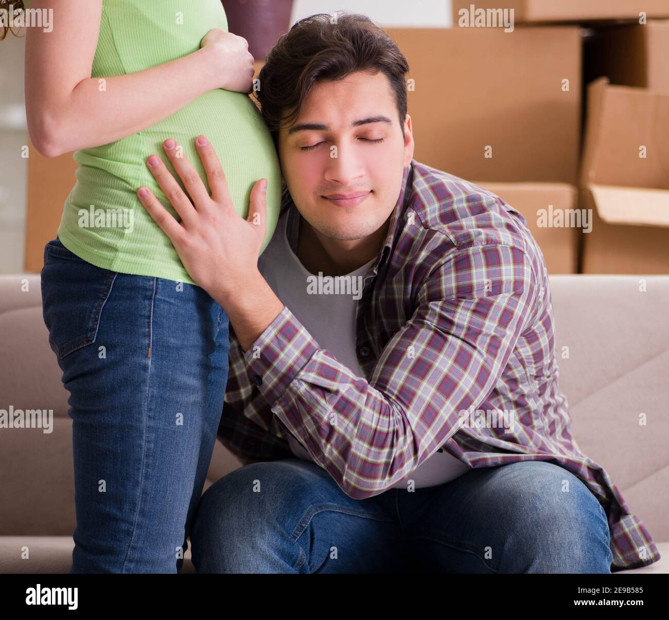 The young couple of man and pregnant wife expecting baby Stock Photo ...