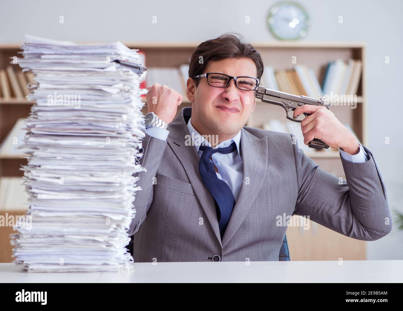 The businessman busy with paperwork in office Stock Photo - Alamy