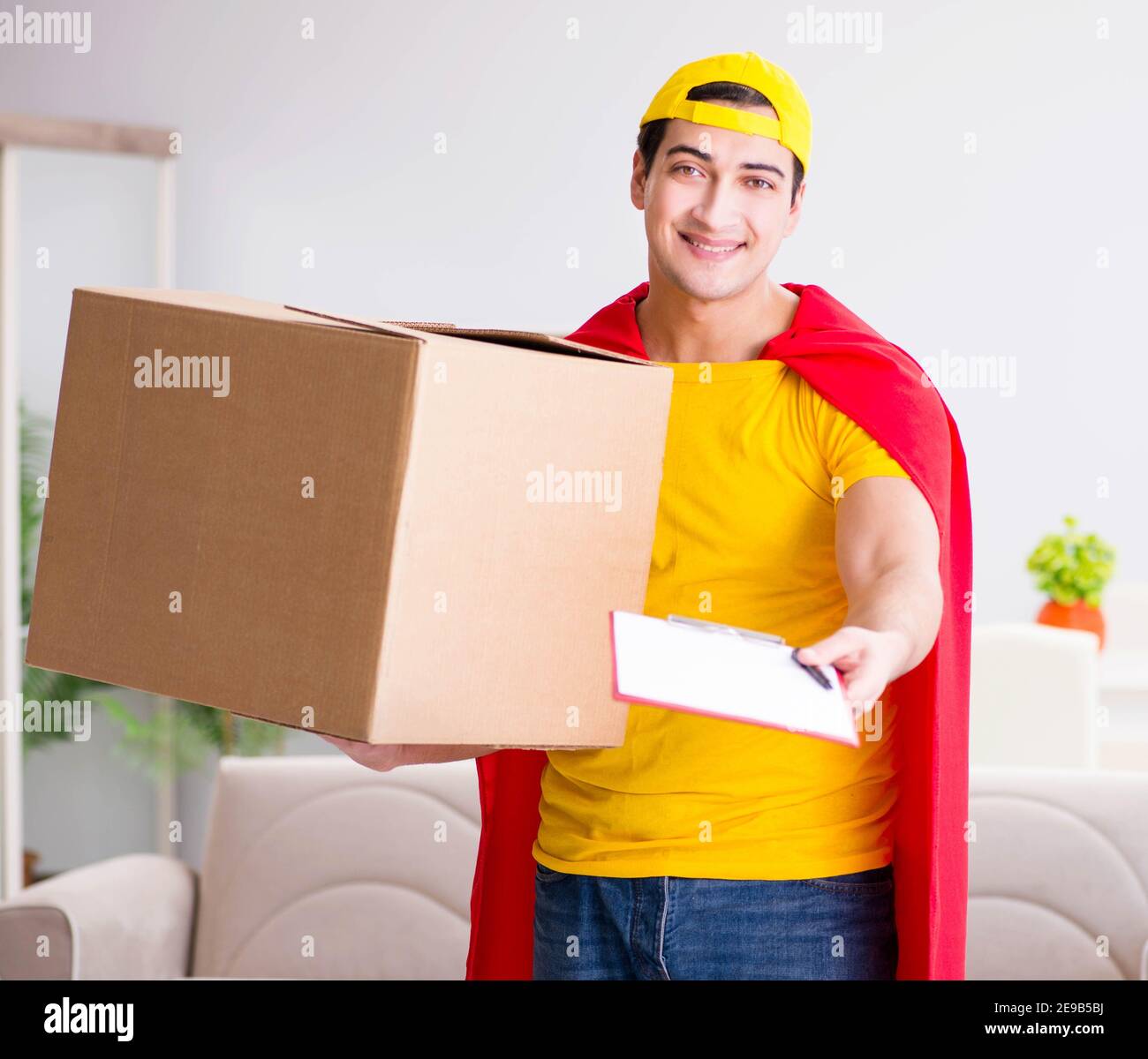 The superhero delivery guy with box Stock Photo - Alamy