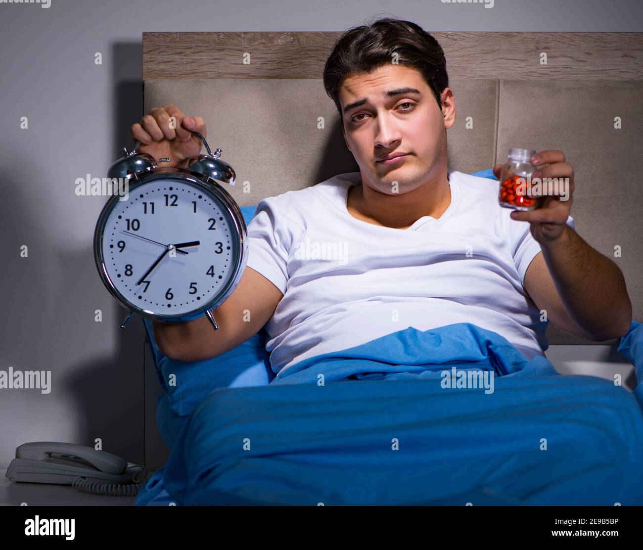 The man having trouble sleeping in bed Stock Photo - Alamy