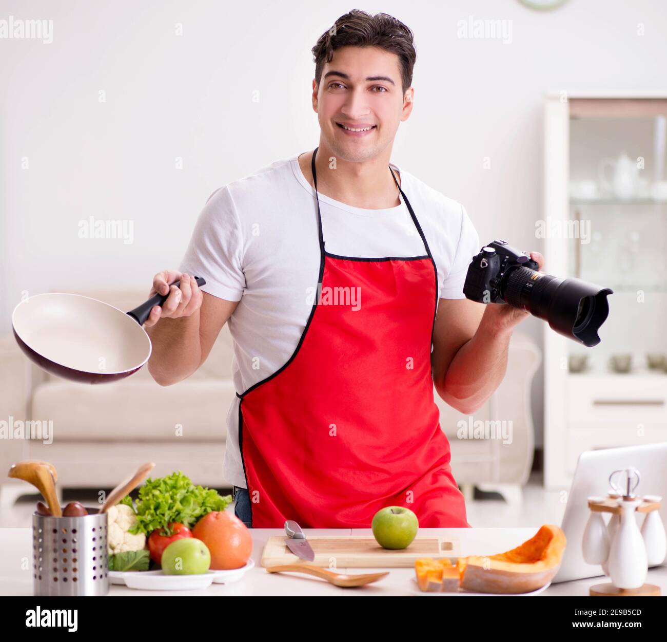 The food blogger working in the kitchen Stock Photo - Alamy