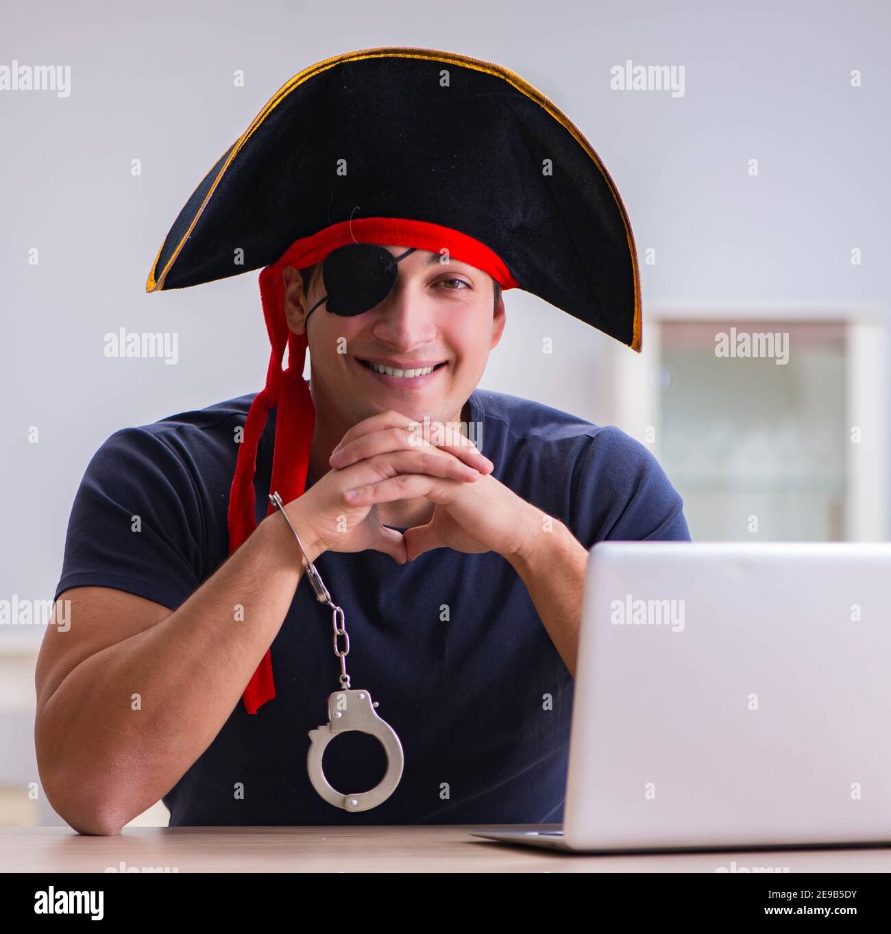 The digital security concept with pirate at computer Stock Photo - Alamy