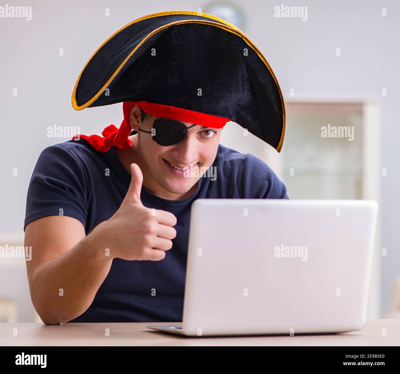 The digital security concept with pirate at computer Stock Photo - Alamy