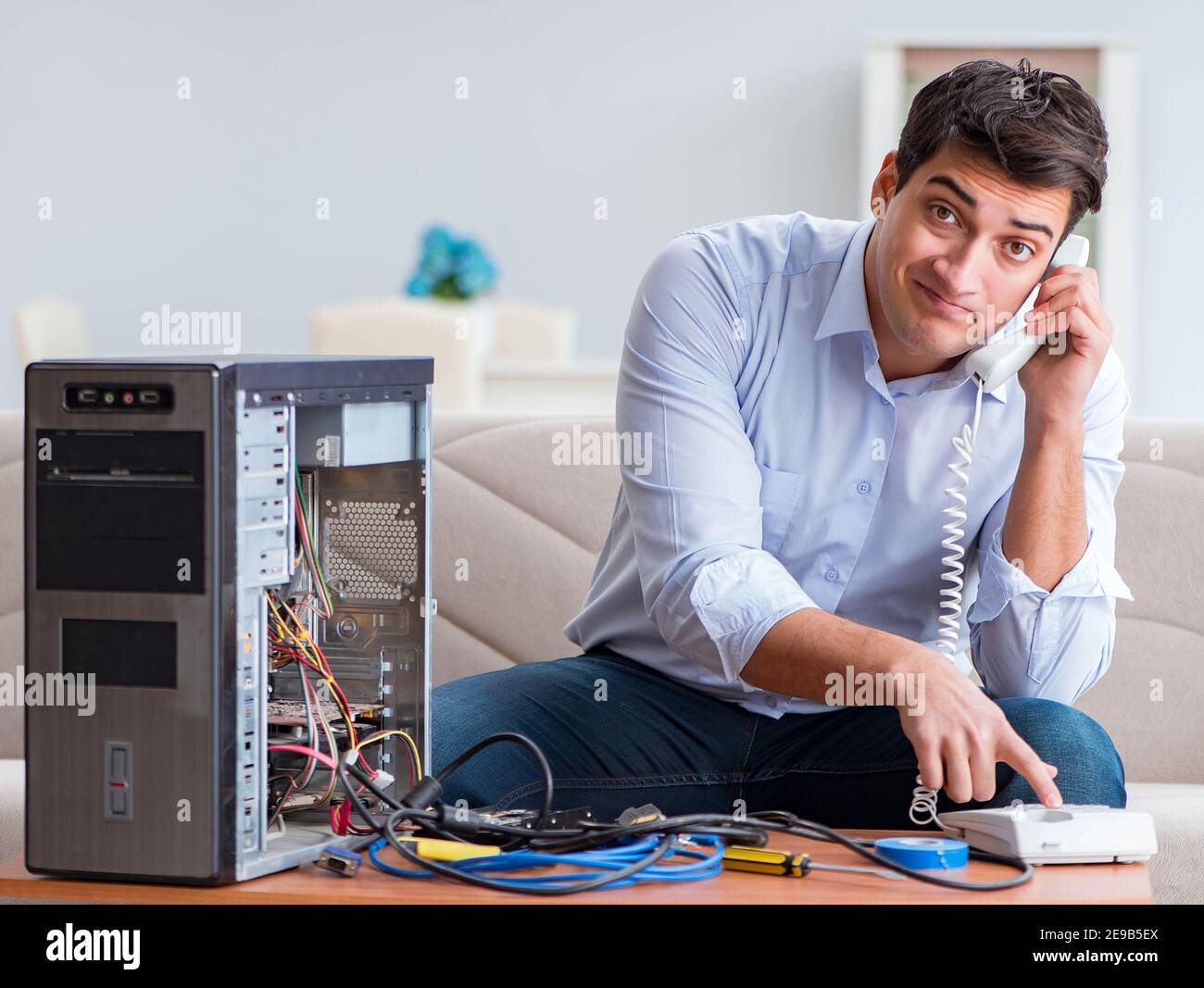 The angry customer trying to repair computer with phone support Stock ...