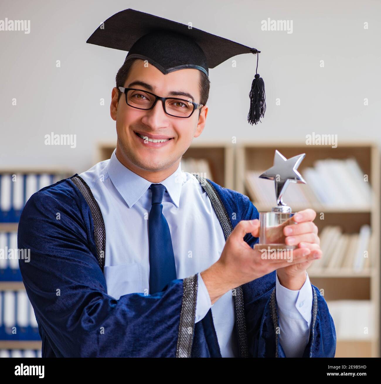 The young man graduating from university Stock Photo - Alamy