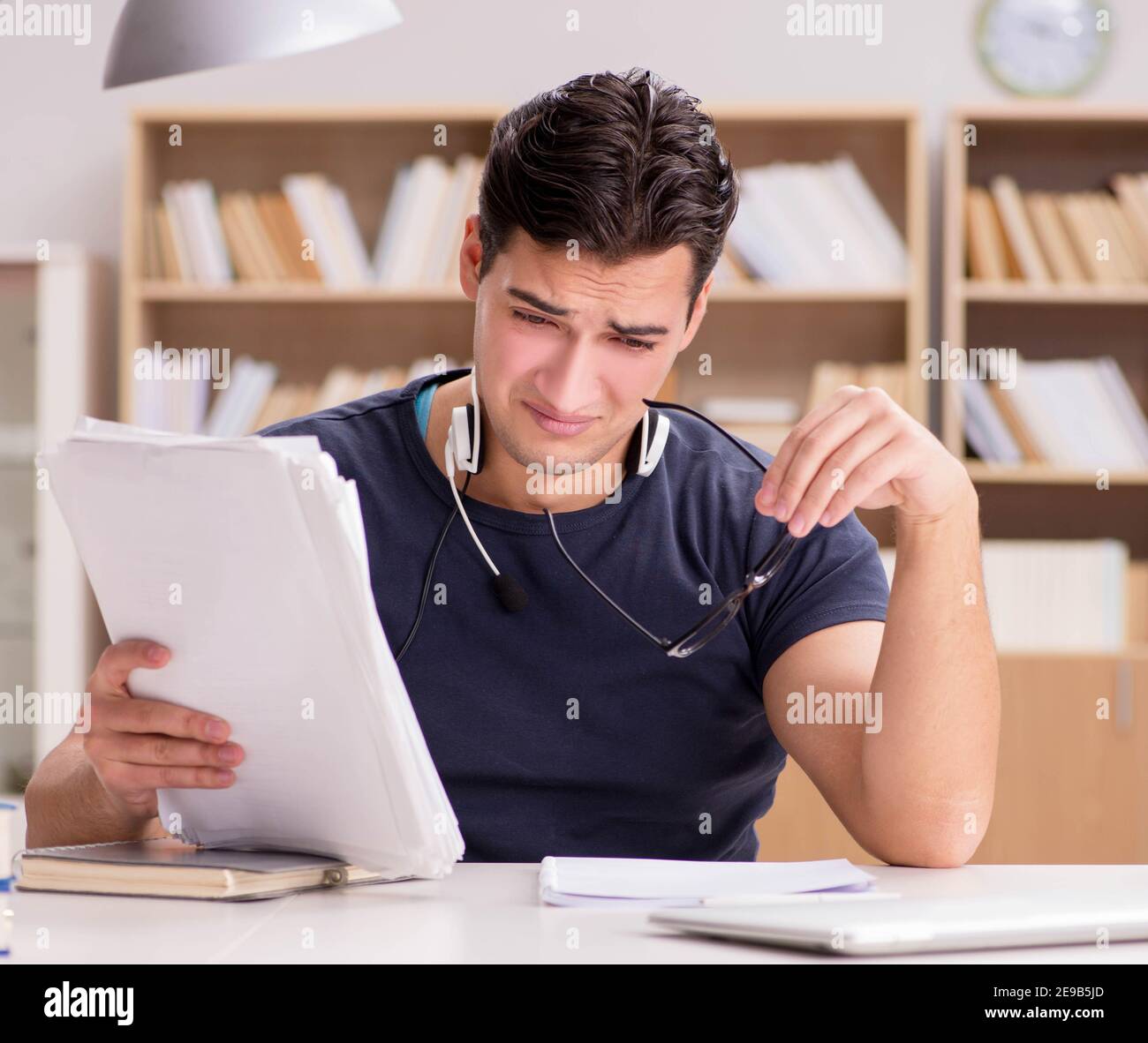 The unhappy student with too much to study Stock Photo - Alamy