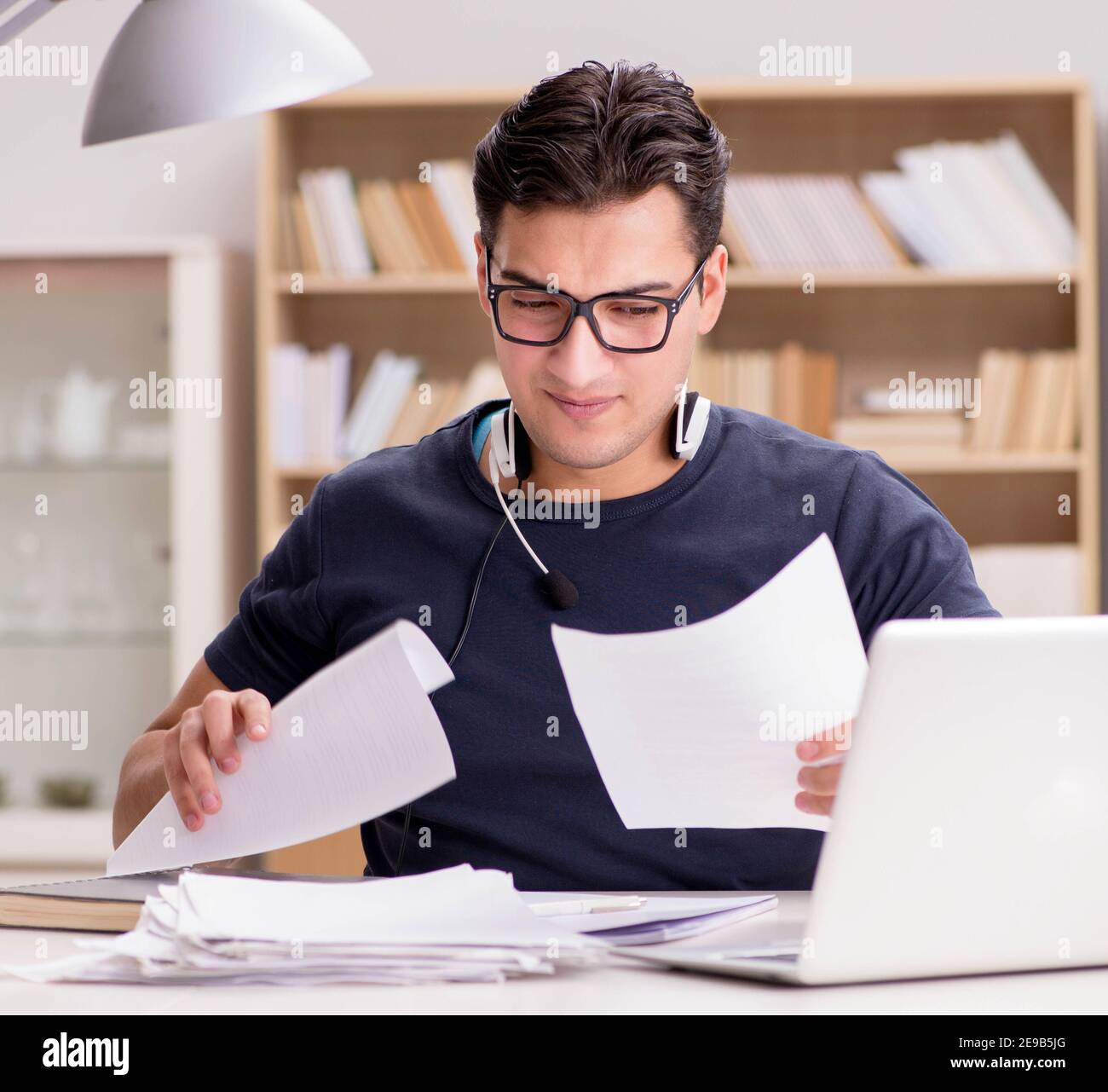 The angry man with too much paperwork to do Stock Photo - Alamy