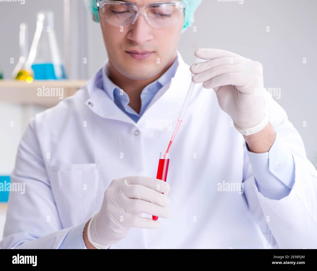 The blood testing in the lab with young scientist Stock Photo - Alamy