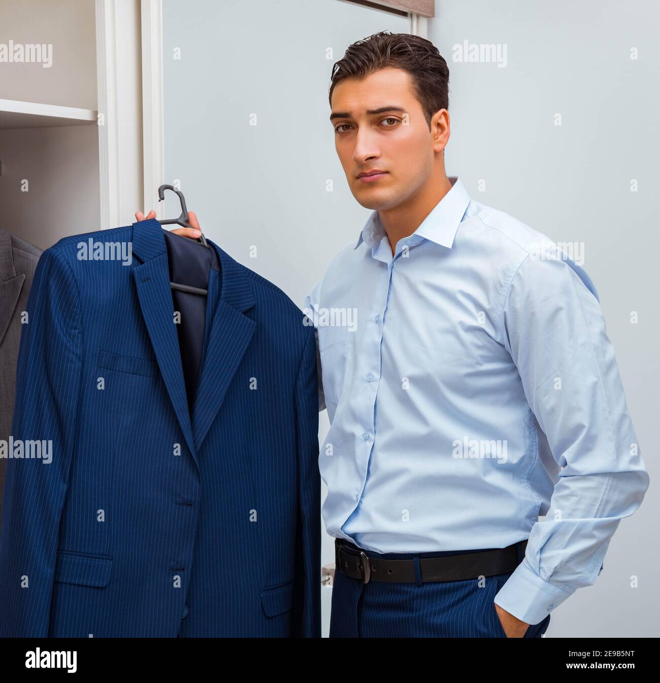 The businessman dressing up for work Stock Photo - Alamy