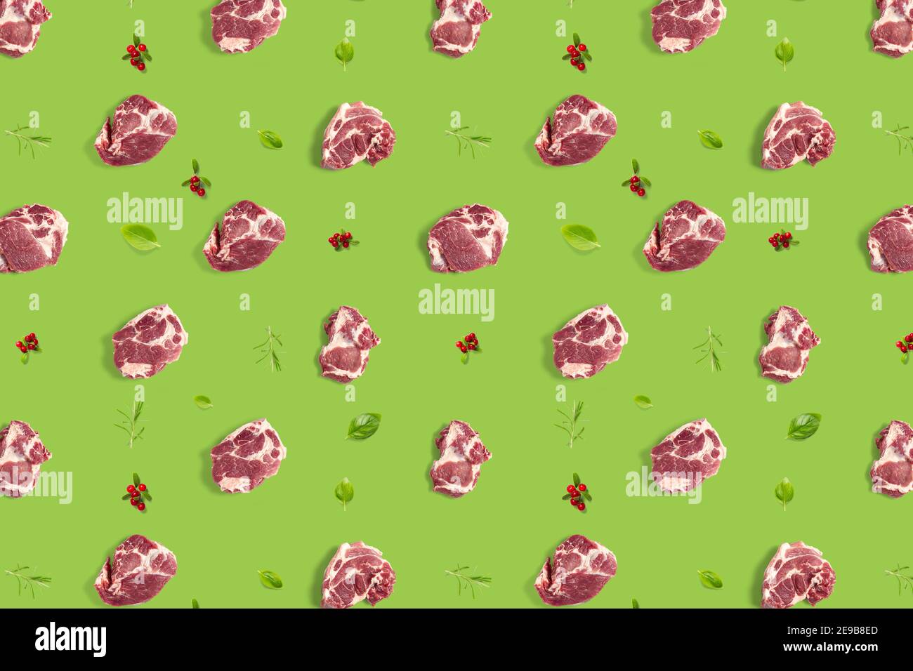 background with raw pork meat slices on green background, raw food ...