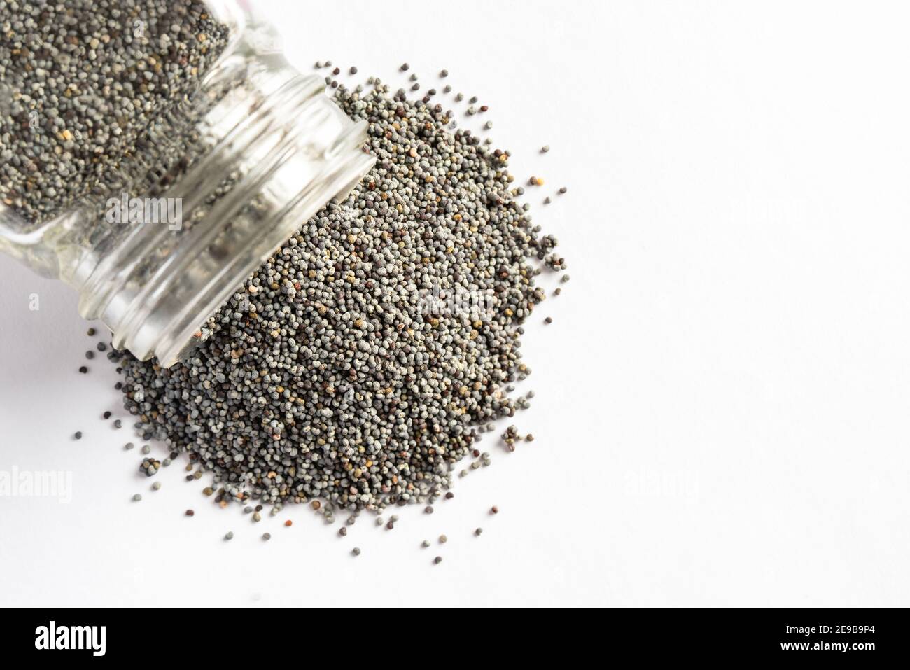 Poppy Seeds Spilled from a Jar Stock Photo - Alamy