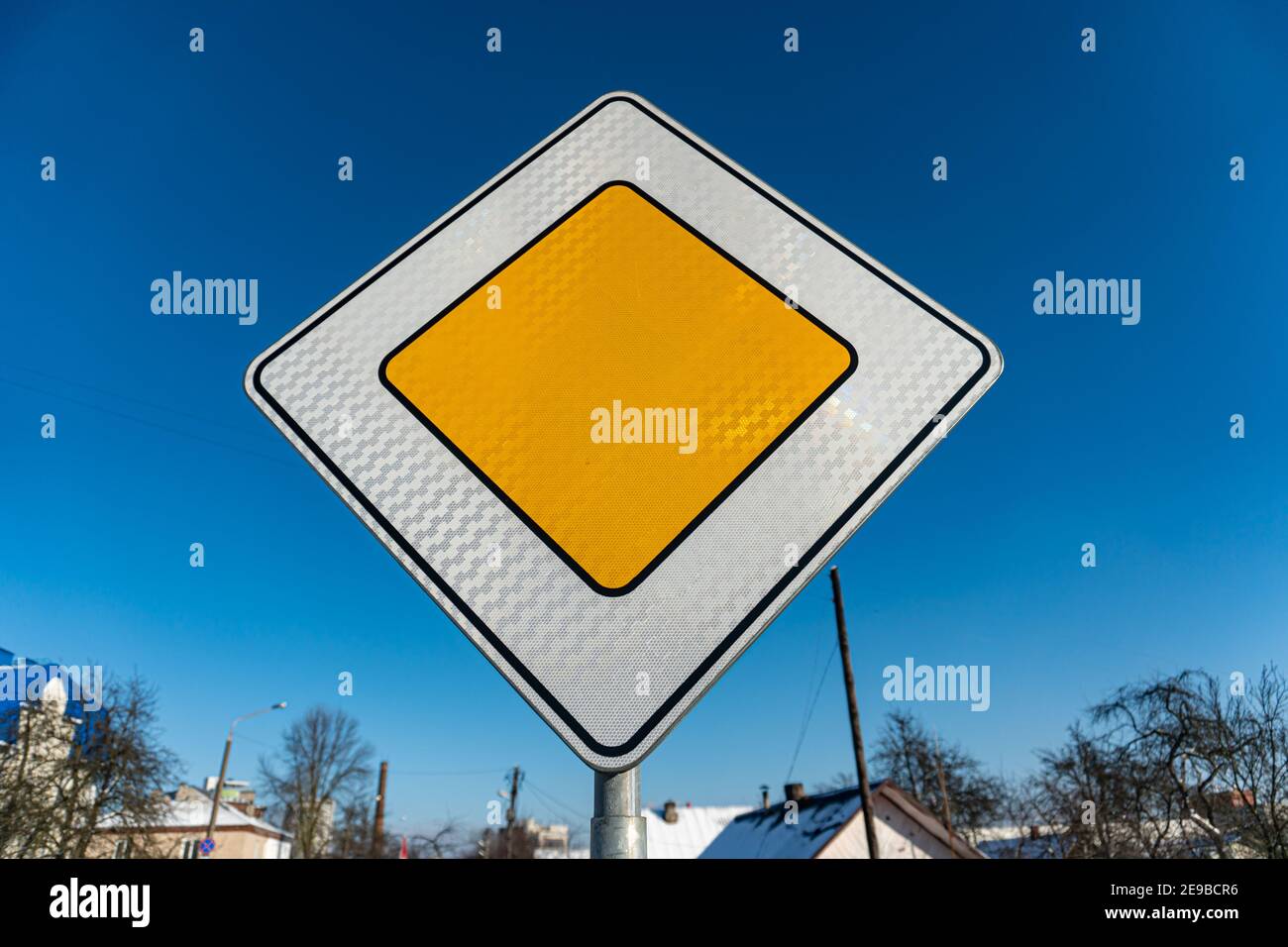 European sign road priority, main road sign on blue sky background ...
