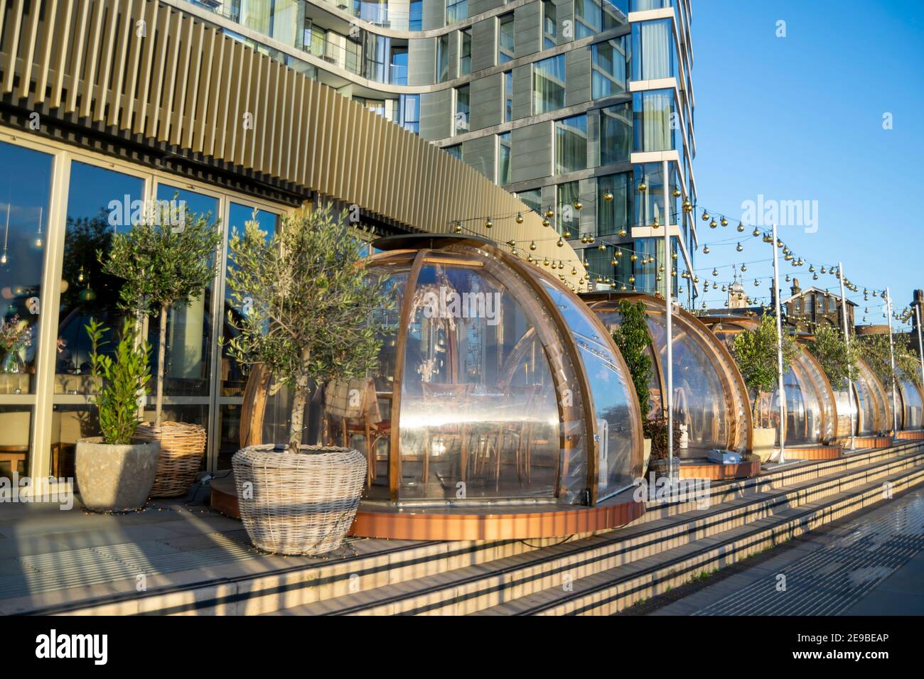 London, UK- 15 Dec 2020: Restaurant outdoor igloos, many separated ...