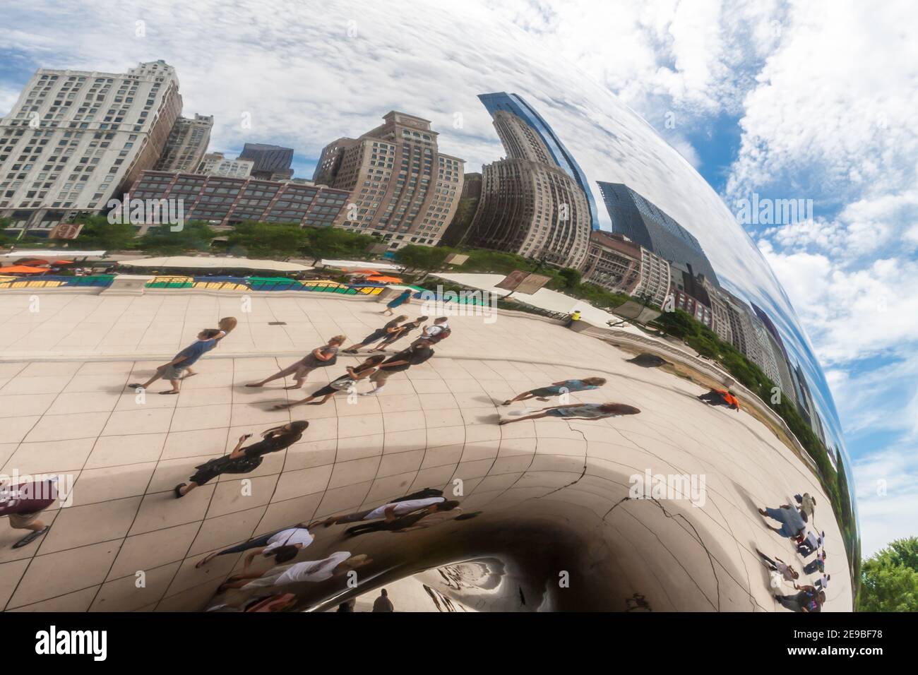 Reflection of People and the Chicago Skyline at The Cloud Gate ...