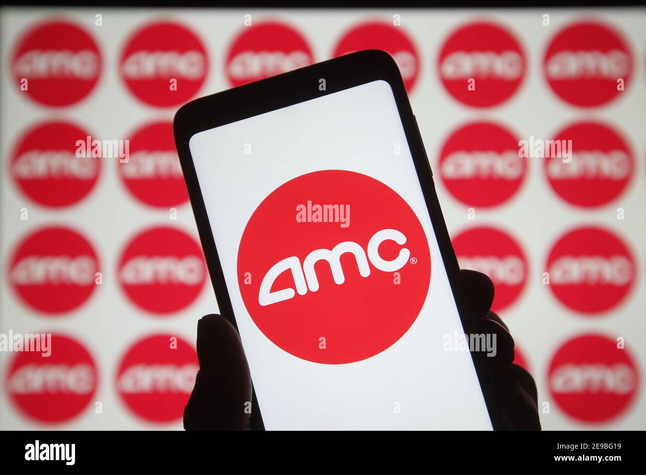 In this photo illustration, an AMC logo seen displayed on a smartphone ...