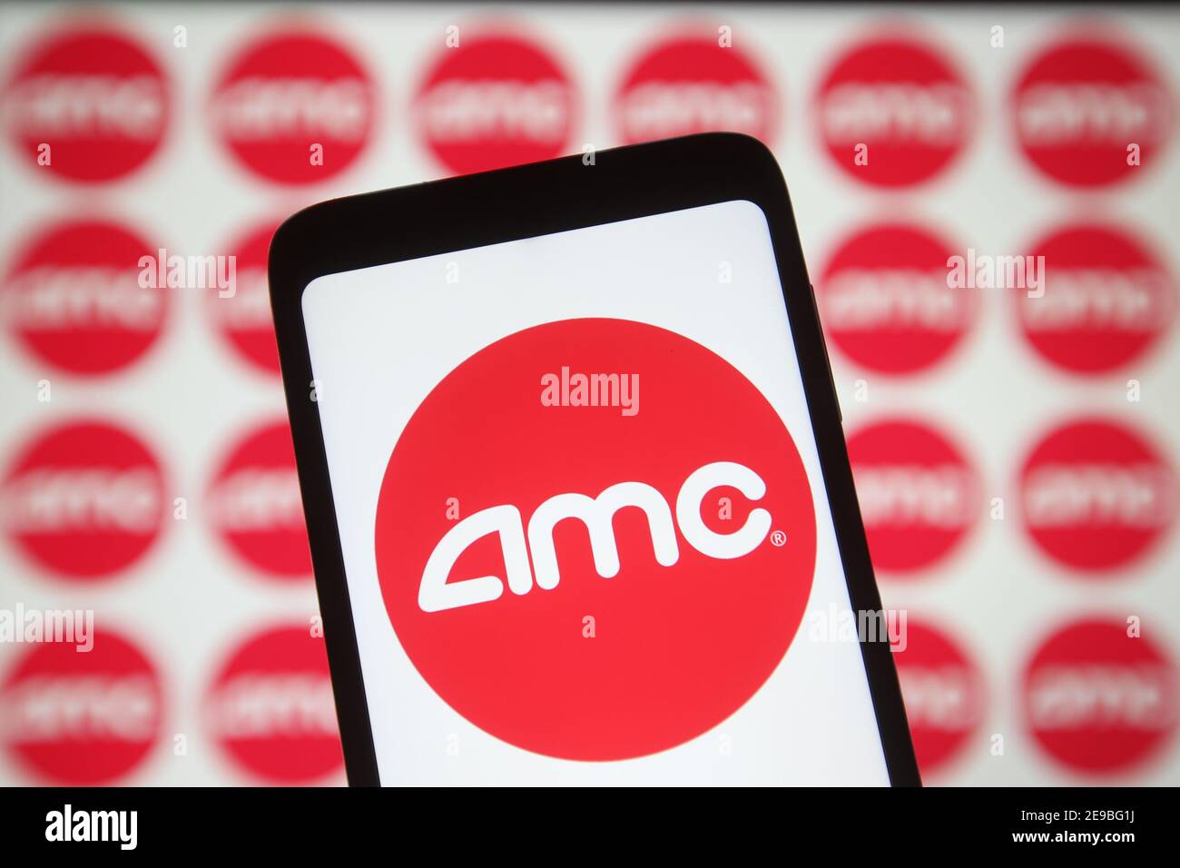 In this photo illustration, an AMC logo seen displayed on a smartphone ...
