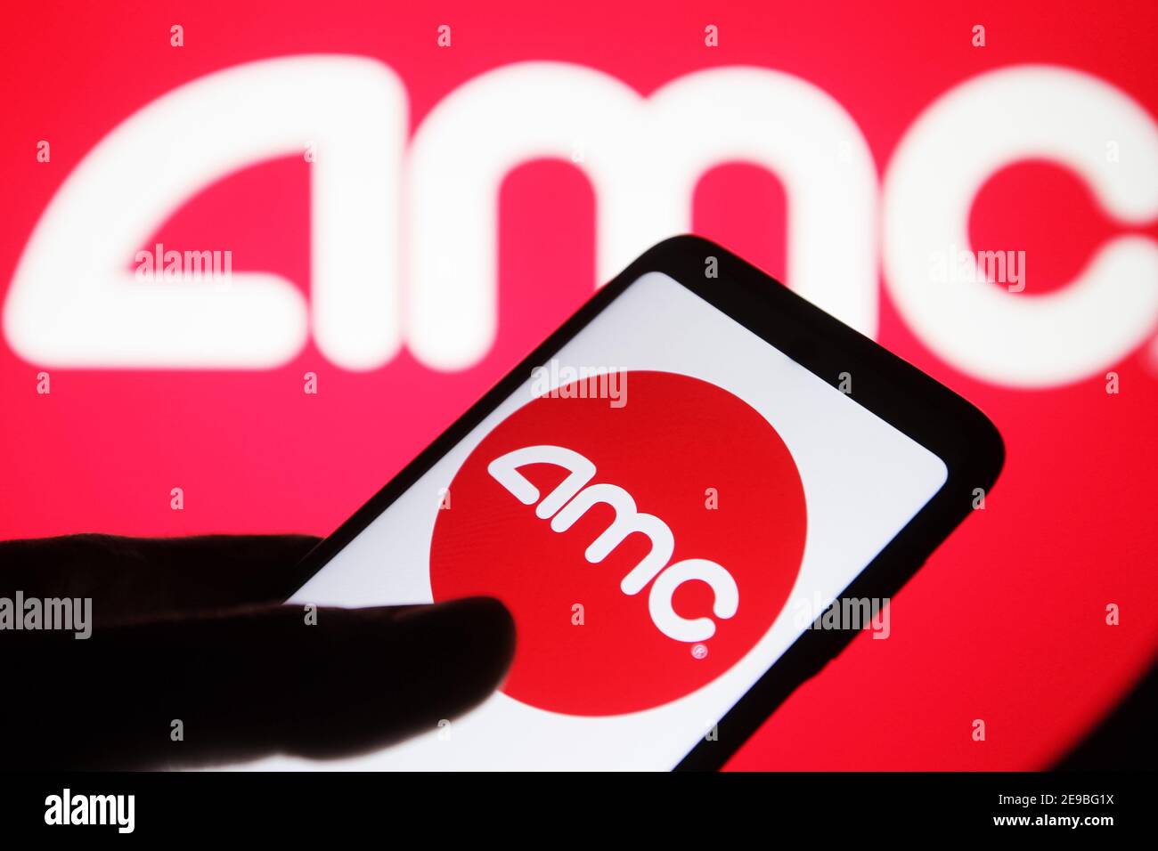 In this photo illustration, an AMC logo seen displayed on a smartphone ...