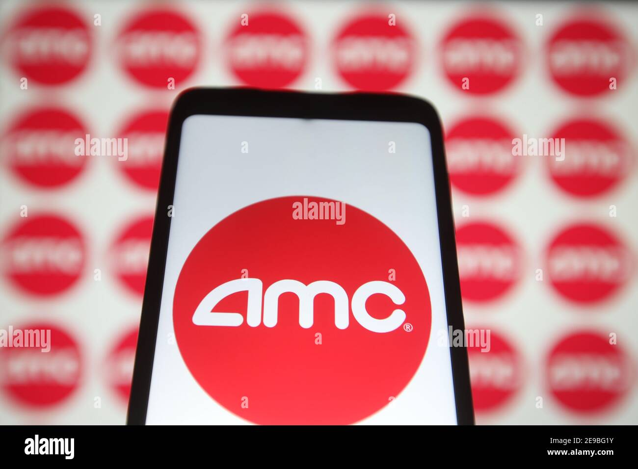 In this photo illustration, an AMC logo seen displayed on a smartphone ...