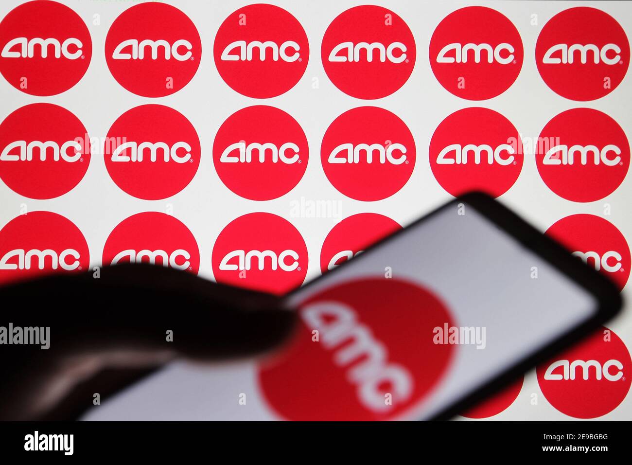 In this photo illustration, an AMC logo seen displayed on a smartphone ...