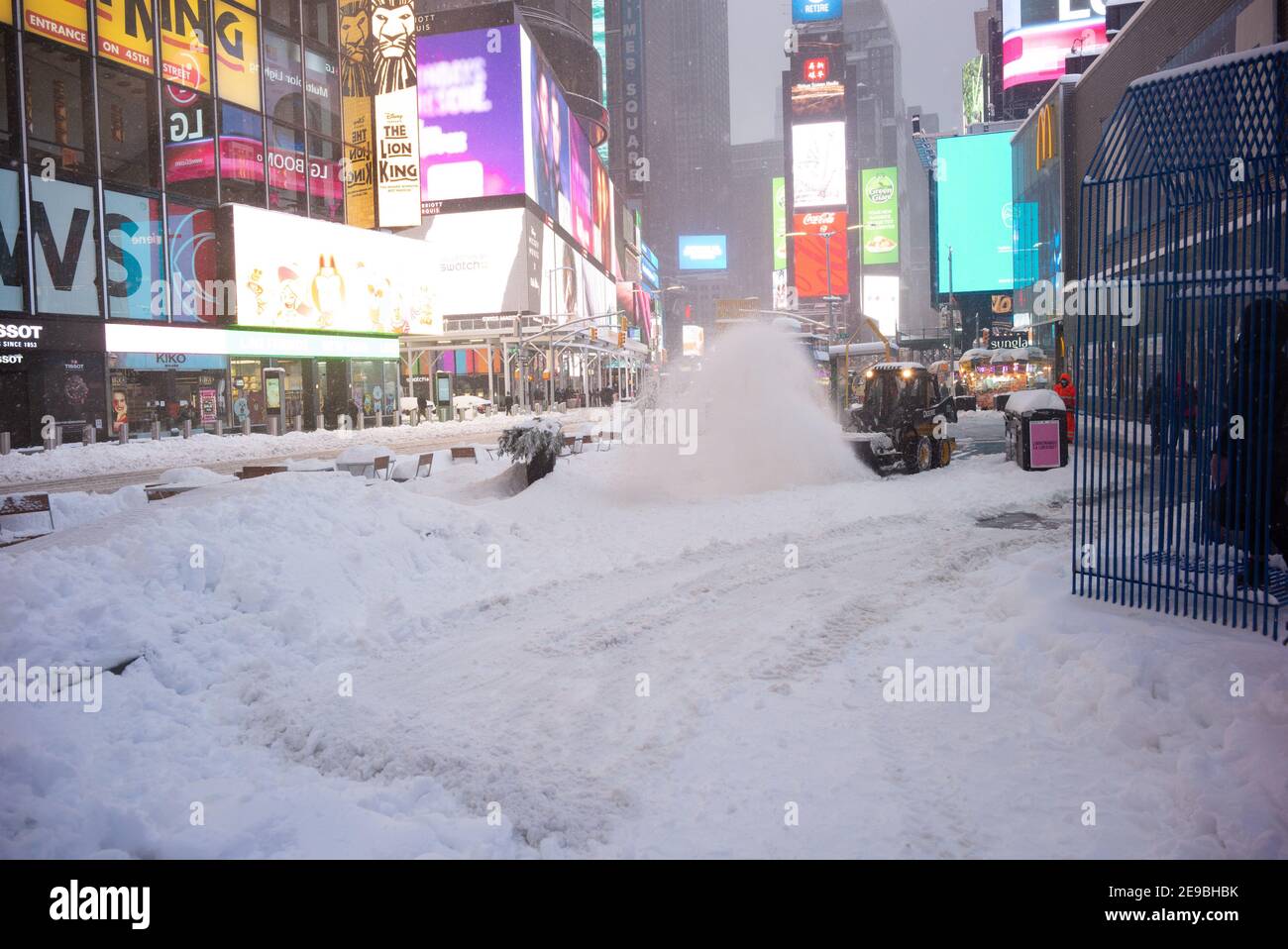 New York City USA Worker using a snow thrower to clear the snow in ...