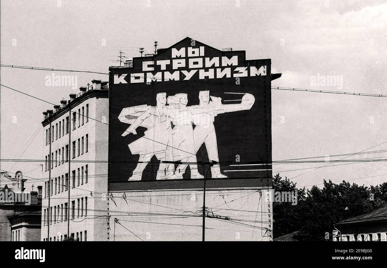 "We are building communism" - an old poster on the building as a ...